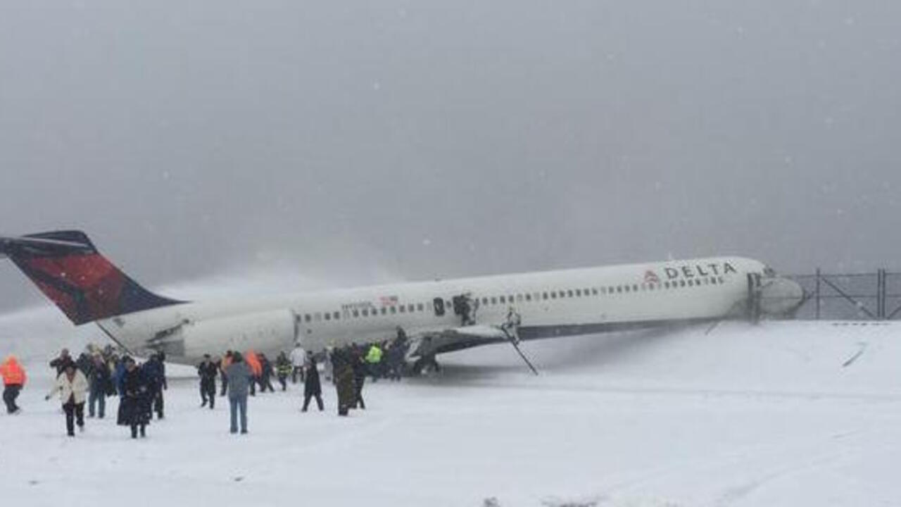 Delta plane slides off runway at New York's LaGuardia airport